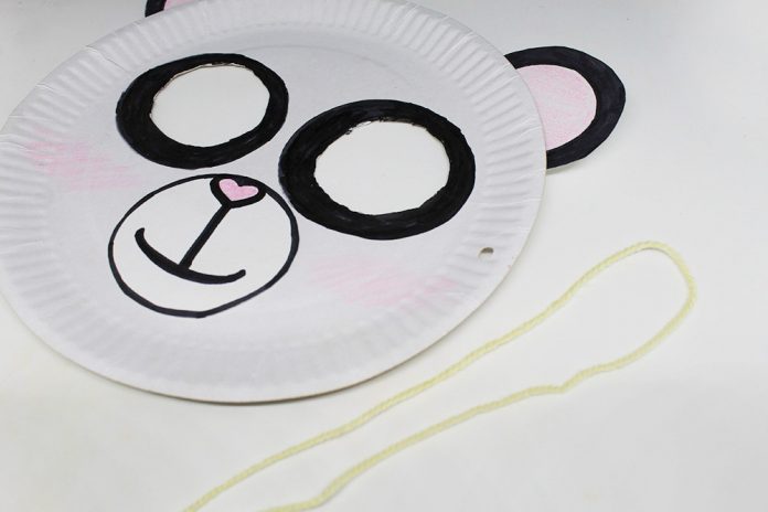 Make a Lovely Paper Plate Panda Bear Mask - diy-magazine.com