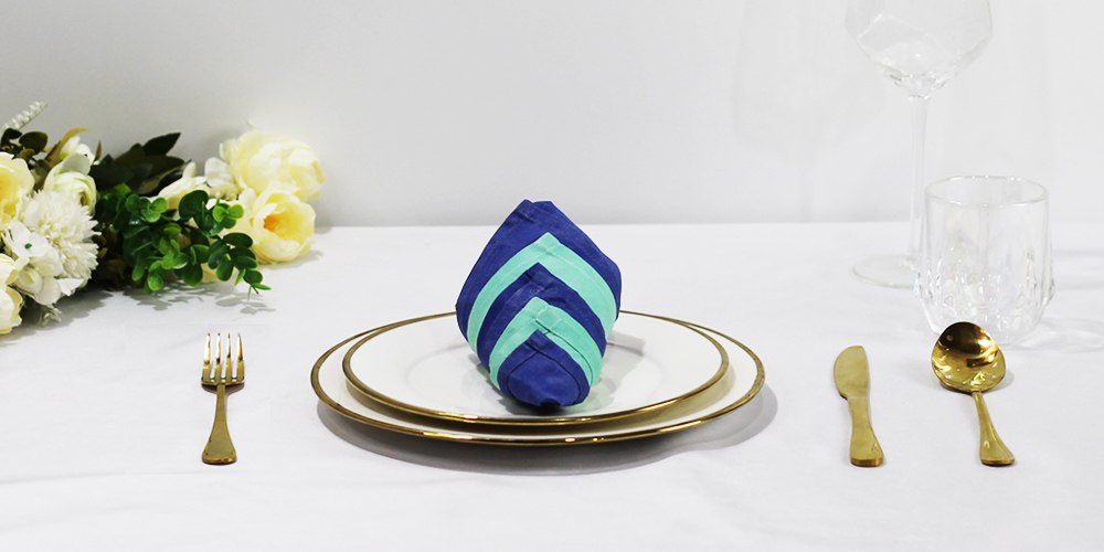 Easy Rolled Napkin Fold | The Croissant Napkin Folding
